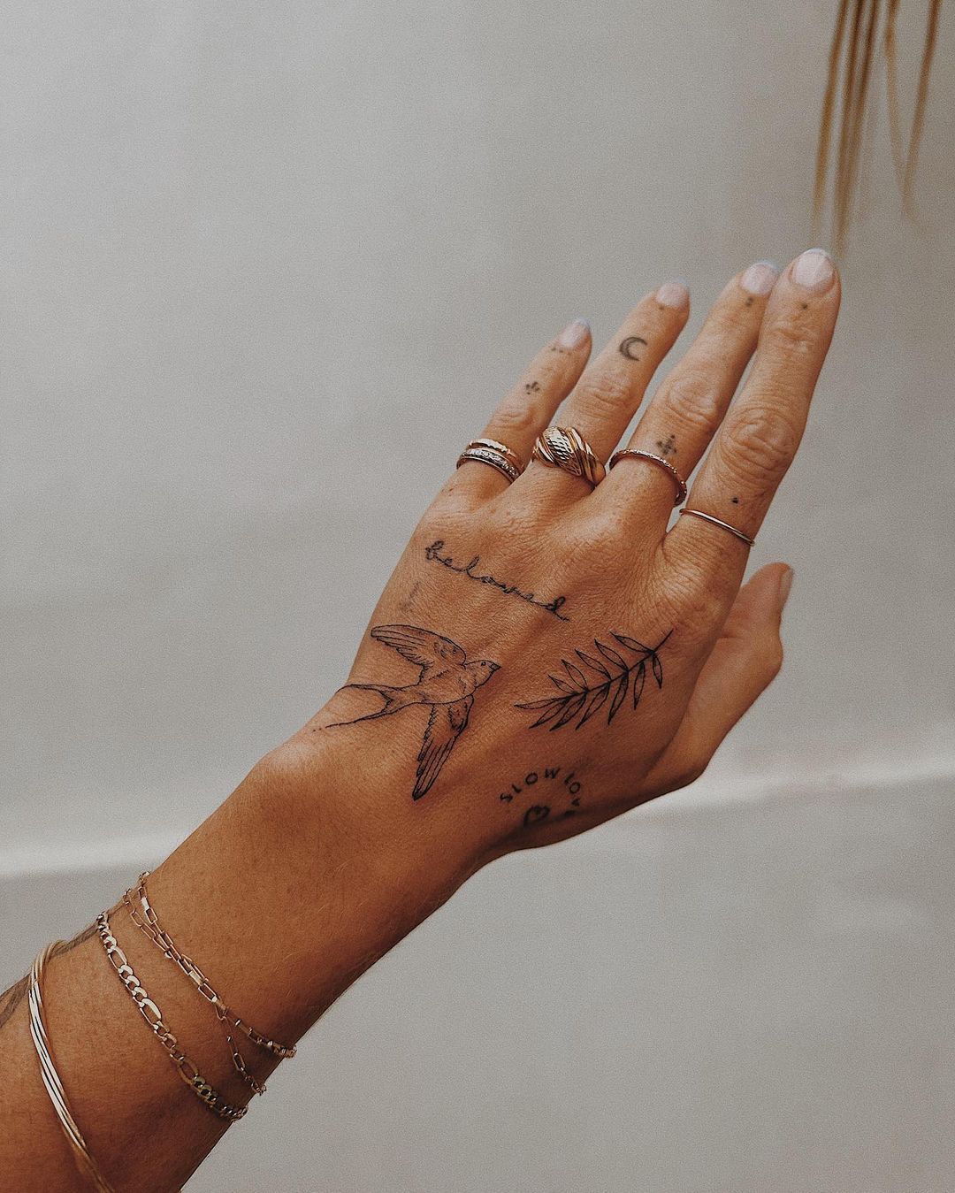 21 Dainty And Dope Hand Tattoos For Women For Any Aesthetic