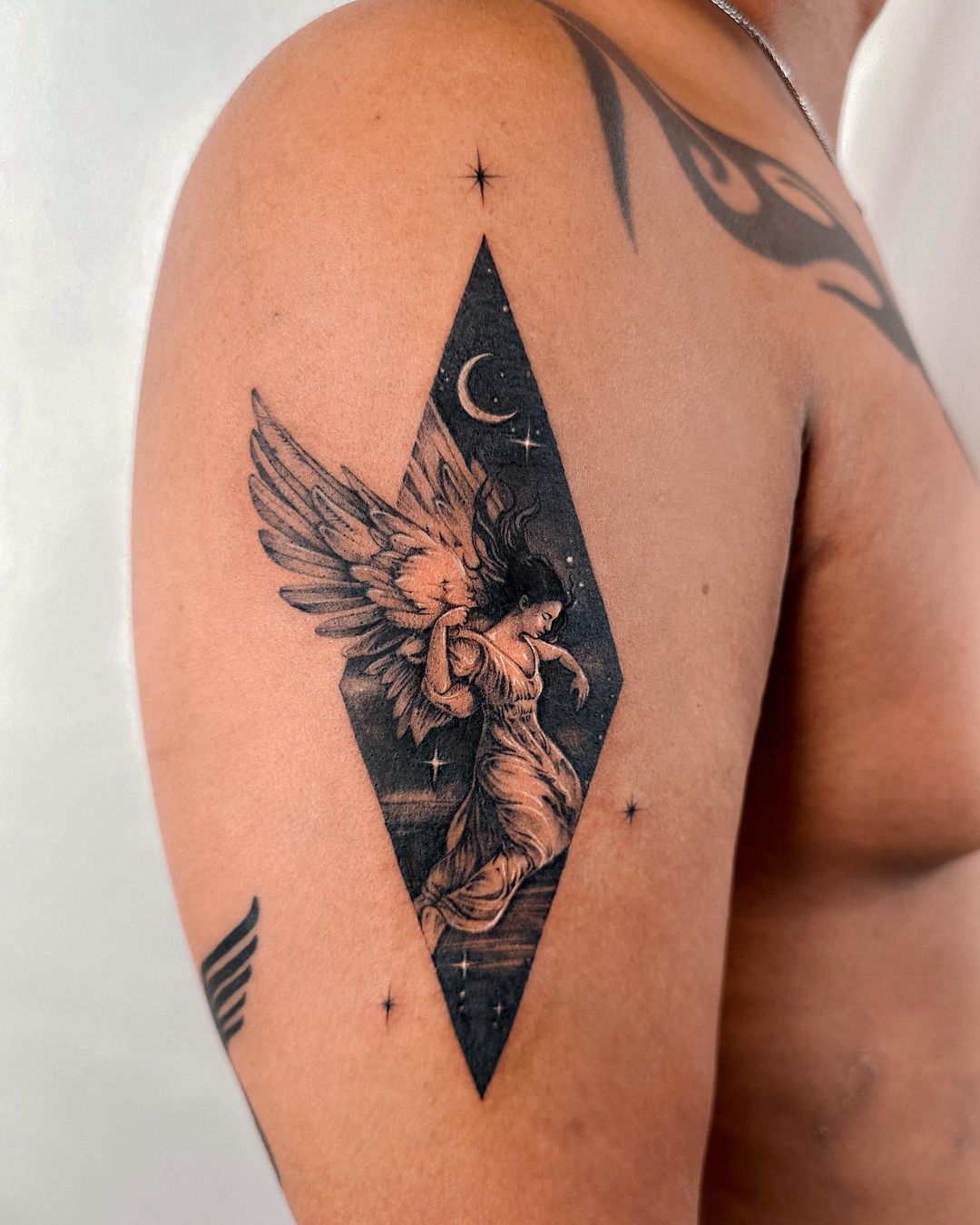 23 Angel Tattoo Ideas: Divine Symbols That Tell A Story