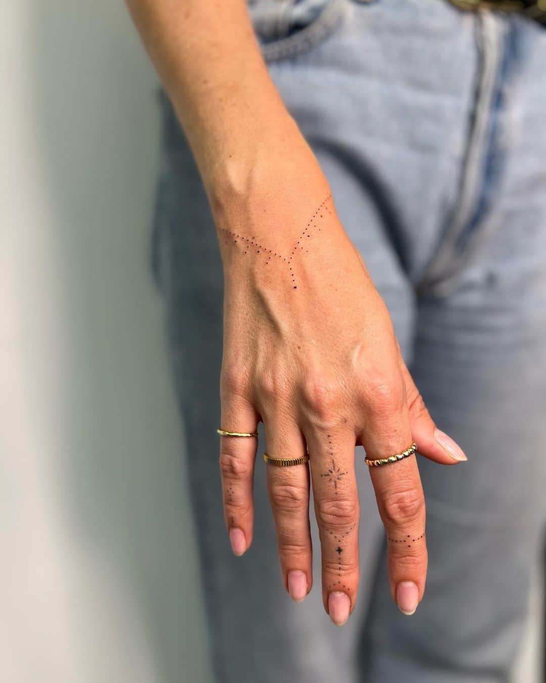24 Tiny Hand Tattoos For The Modern Minimalist