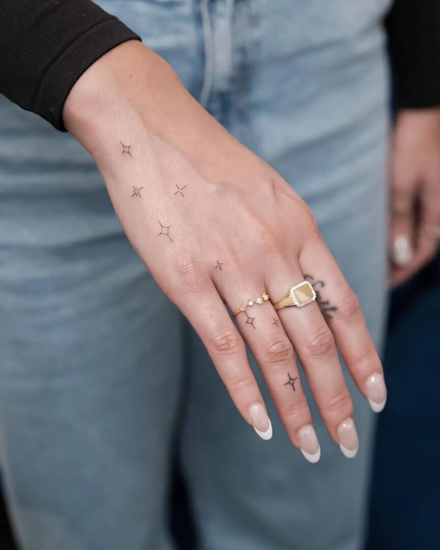 24 Tiny Hand Tattoos For The Modern Minimalist