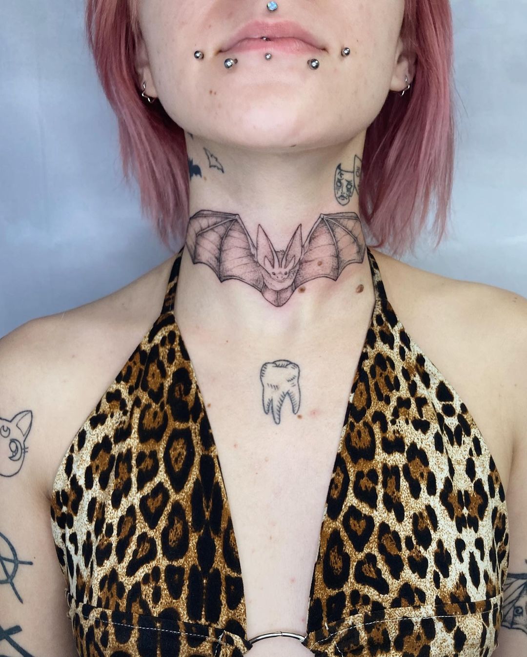 25 Fierce Front-Neck Tattoos That Will Blow Your Mind