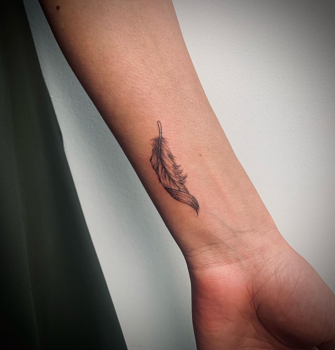 Simple And Symbolic, 24 Feather Tattoo Ideas To Inspire You