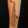 27 Superior Saxophone Tattoos That Hit All The Right Notes