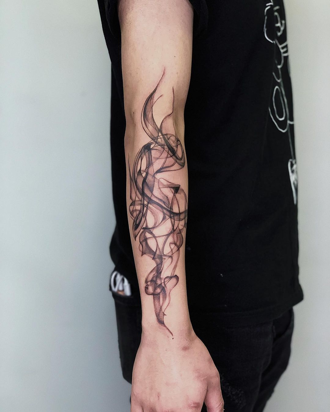 21 Satisfying Smoke Tattoos That'll Light Up Your Day