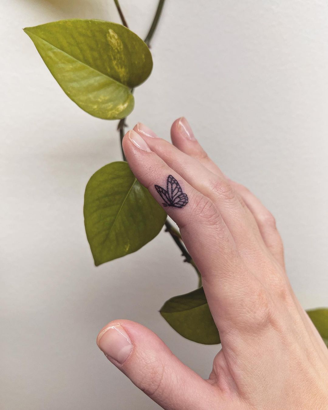 25 Unique Butterfly Finger Tattoos That'll Make You Flutter