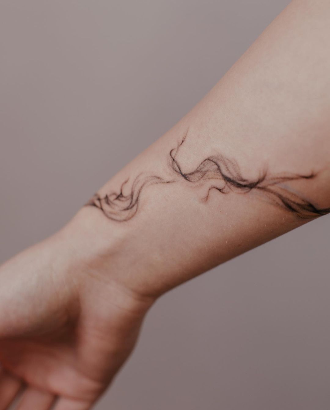 21 Satisfying Smoke Tattoos That'll Light Up Your Day