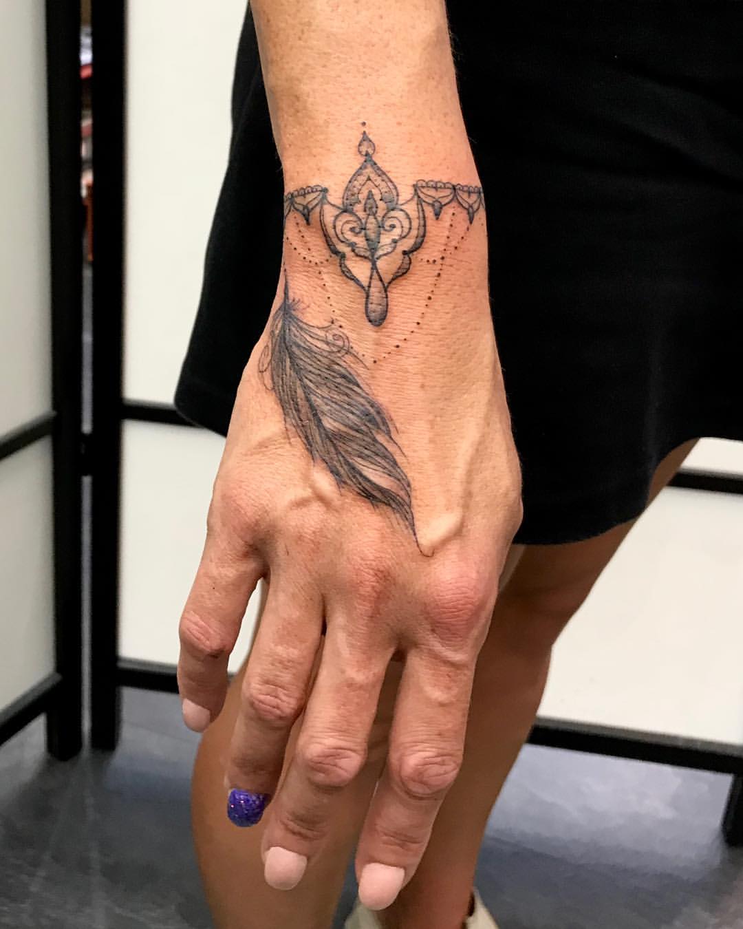 18 Elite Feather On Hand Tattoos: Handy Symbols Of Freedom