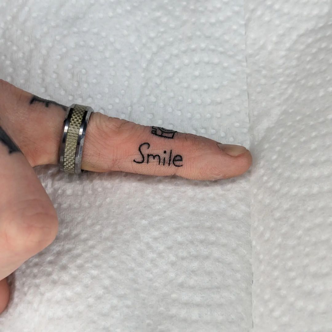 20 Attractive Finger Tattoos With Words For Tales On Skin