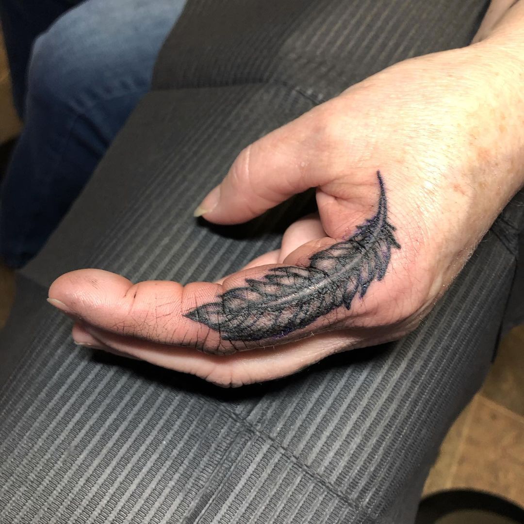 11 Epic Feather On Finger Tattoo Ideas To Wear Like A Ring
