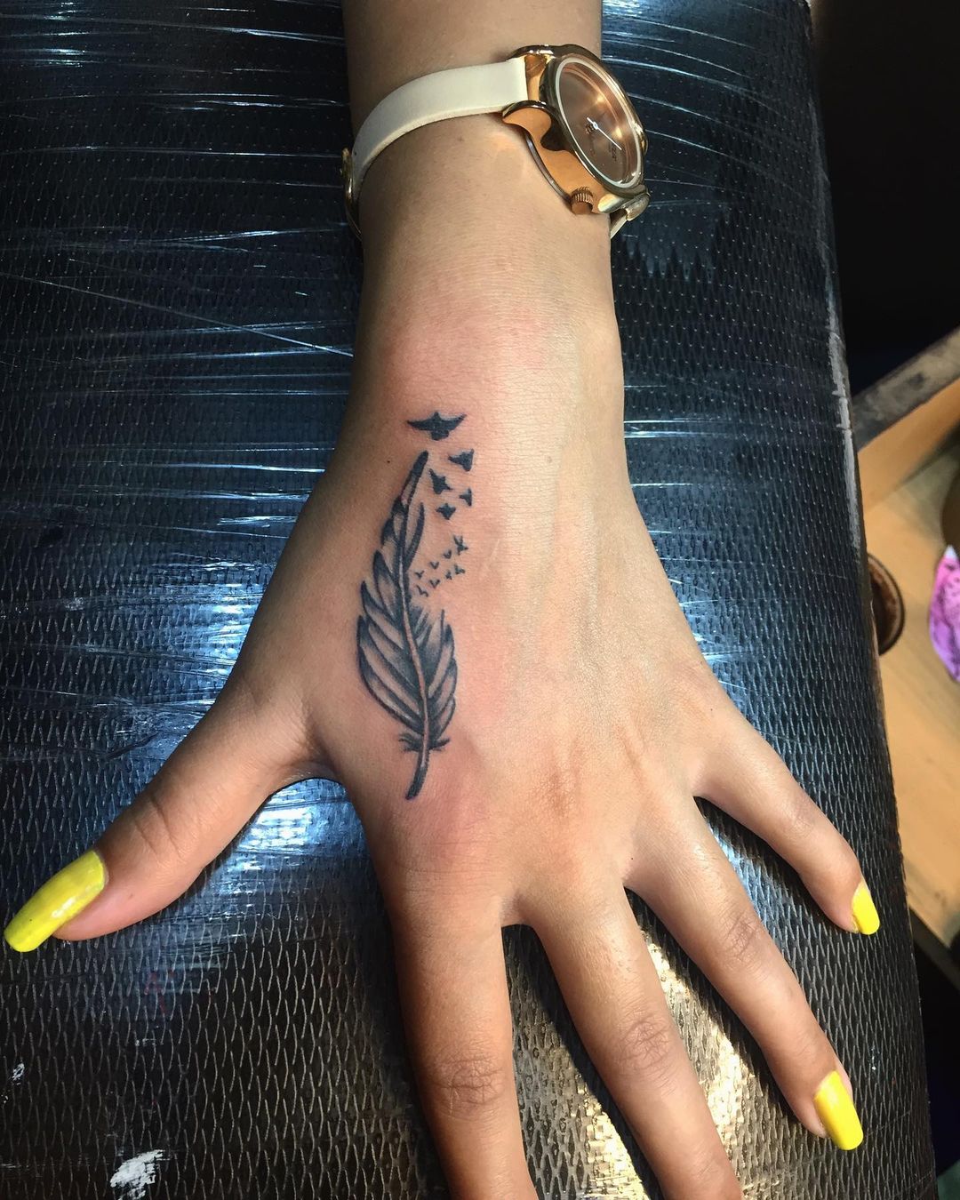 18 Elite Feather On Hand Tattoos: Handy Symbols Of Freedom