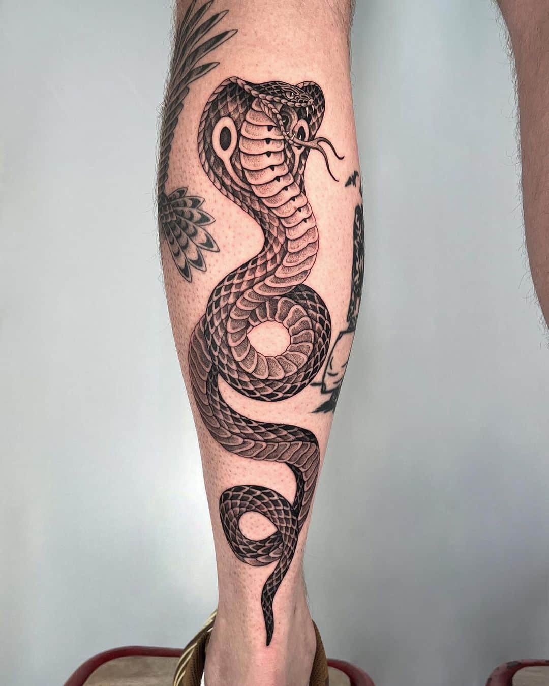 20 Popular Cobra Tattoos That'll Make You Slither With Style